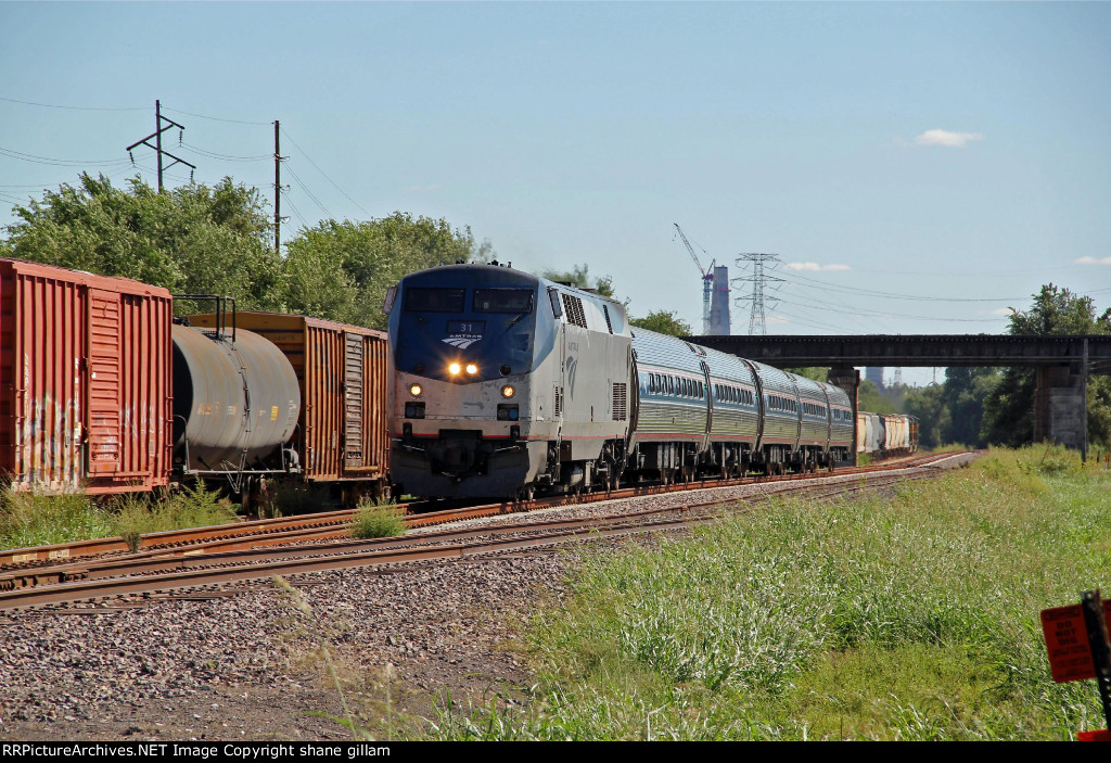 AMTK 31 meets a sb up freight while on the way toward Chicago